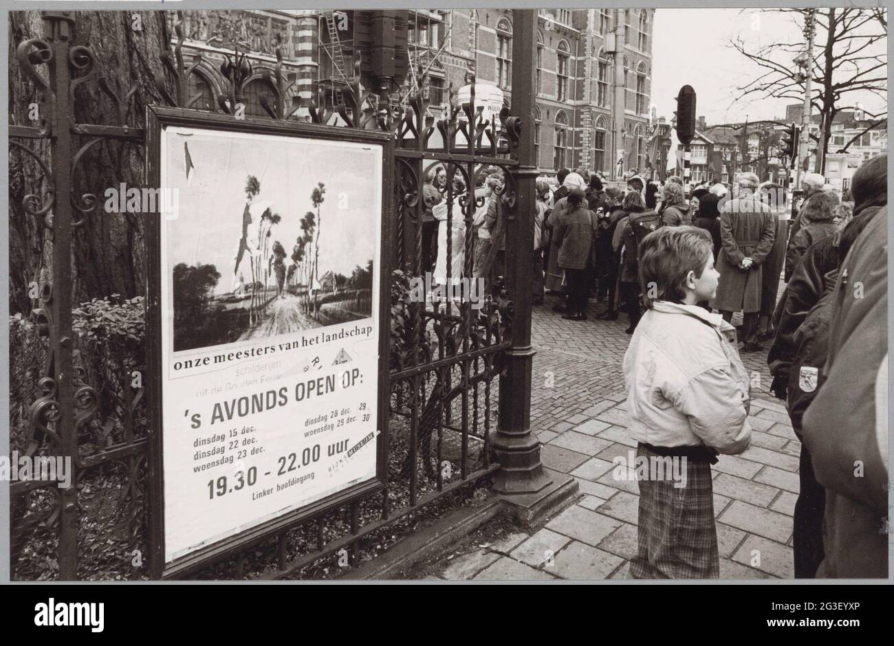 Public in the eastern main entrance, in the foreground a poster of the ...