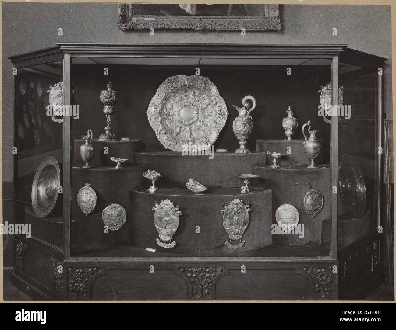 Showcase with silver objects, including gift tubs, scales and funeral ...