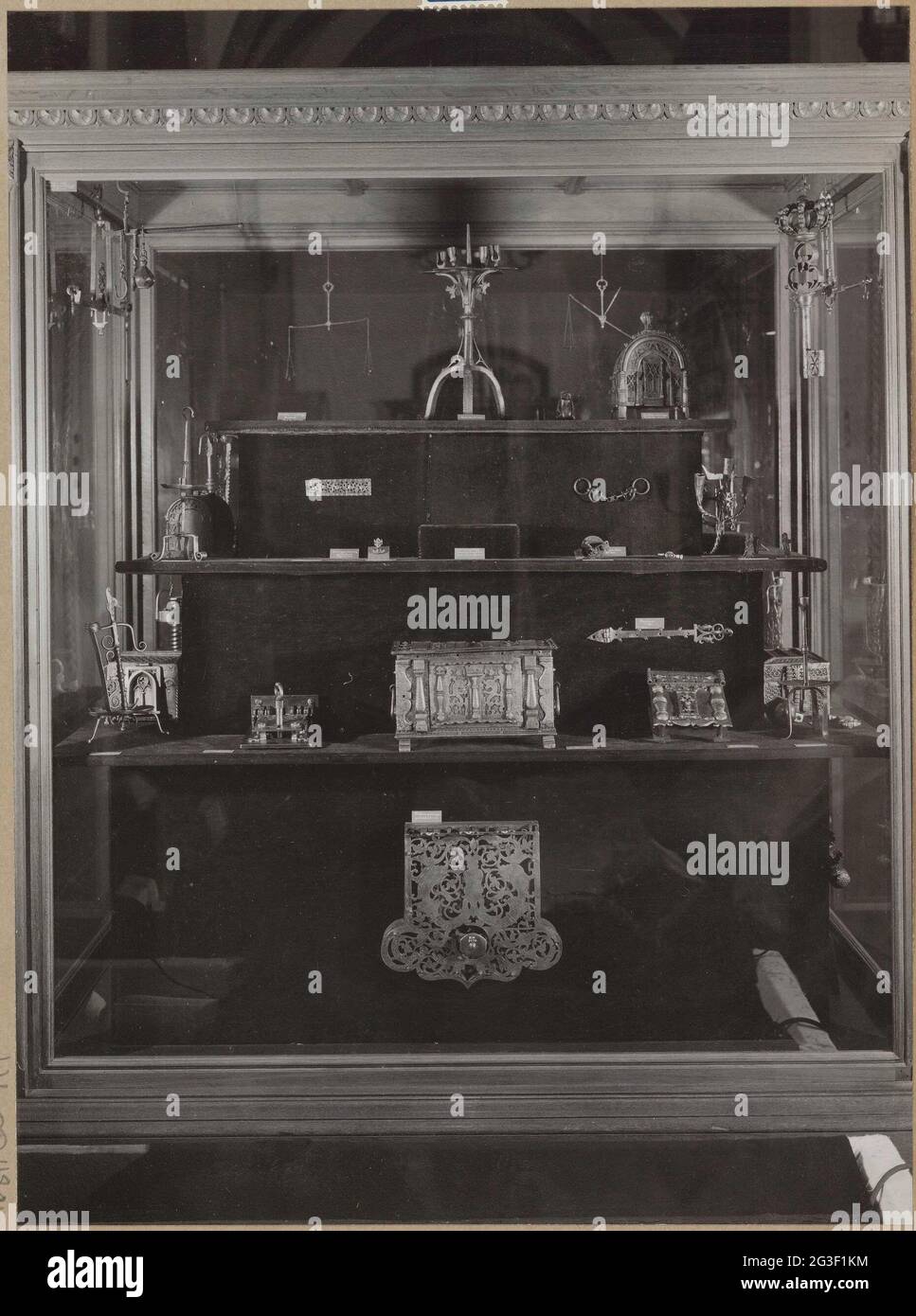 Showcase with metal objects including crates, referred to as iron tray ...