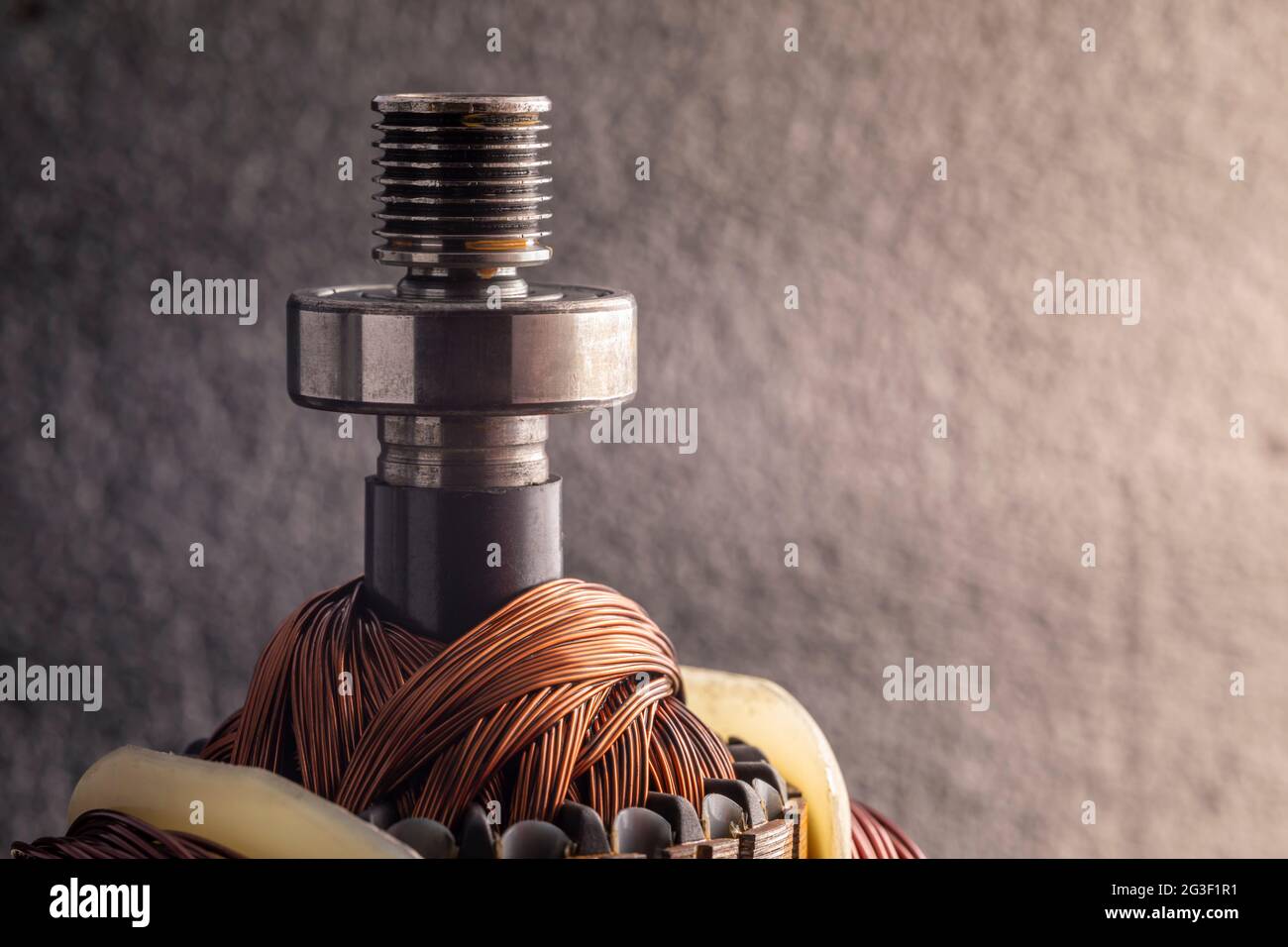 Belt pulley on the rotor of the electric motor. Copper motor windings ...