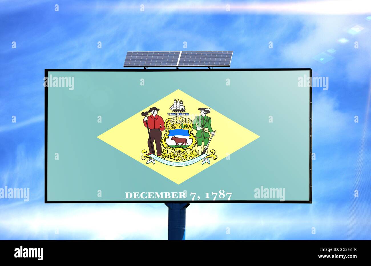 Billboard with State of Delaware flag and solar battery on blue sky ...