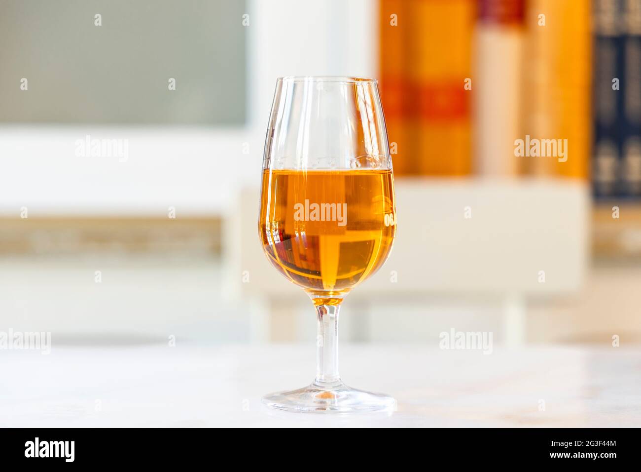 Sweet white Porto wine on the table with a lot of copy space on both ...