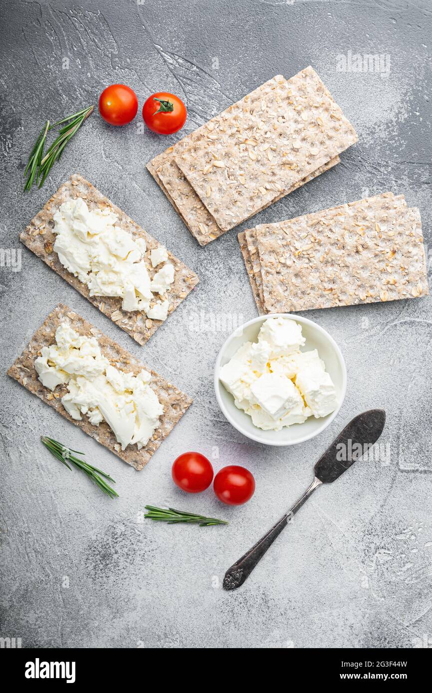 Wholegrain Rye Crispbread with cream cheese set, on gray stone table ...