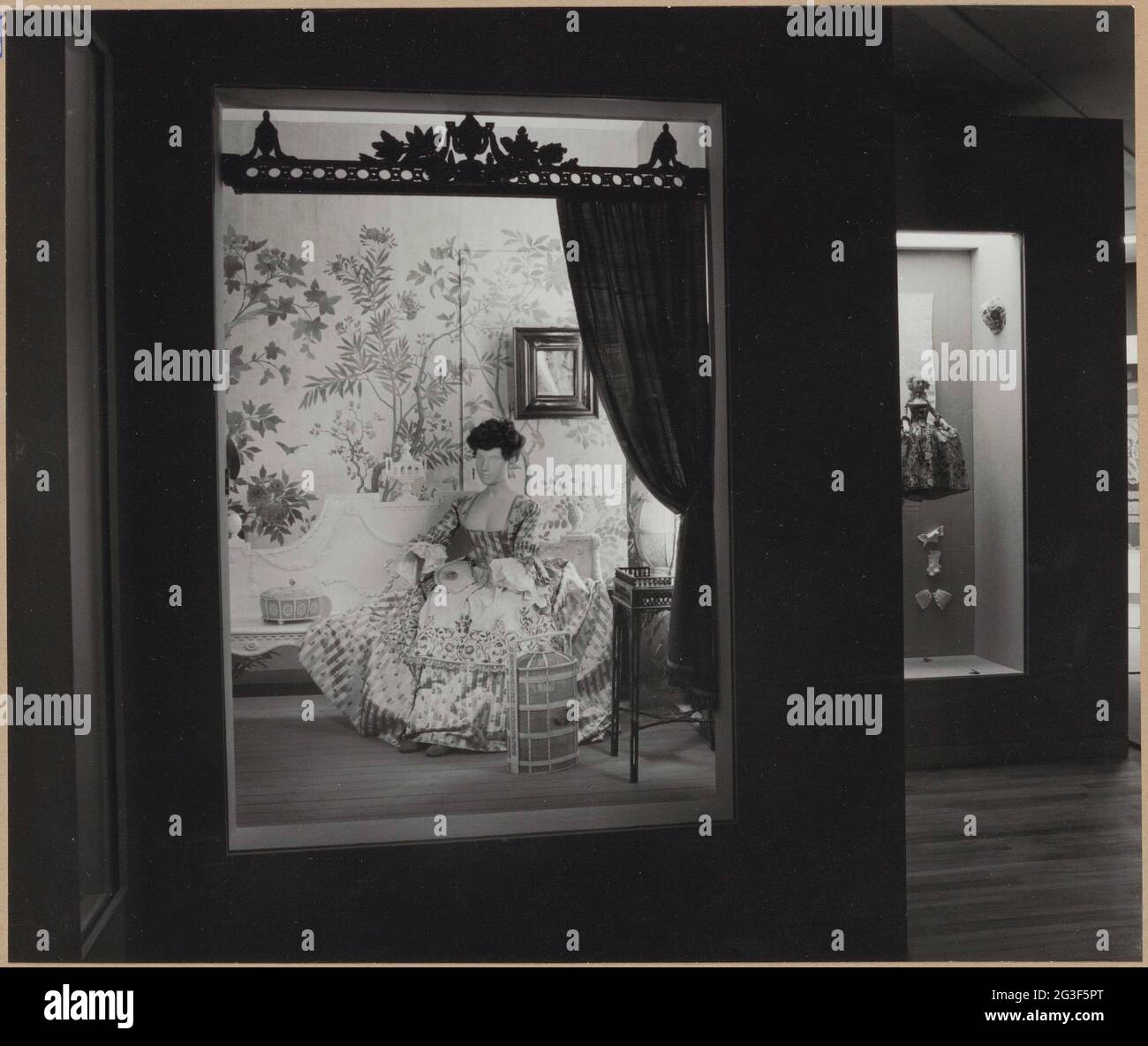 Showcase with doll with clothing in an interior; Arts and crafts 1962 ...