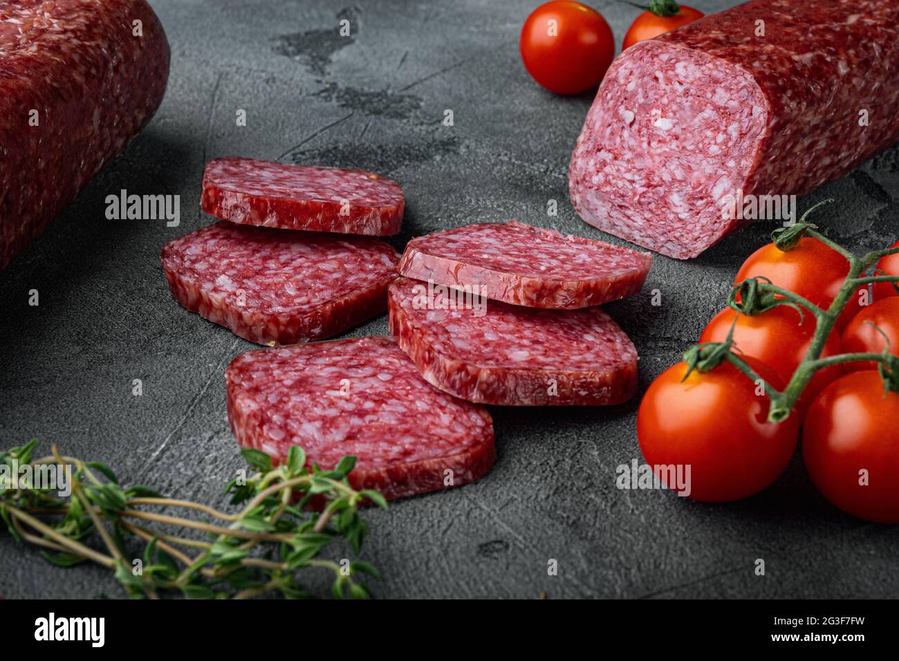 Salami with herbs and spices set, on gray stone table background Stock ...