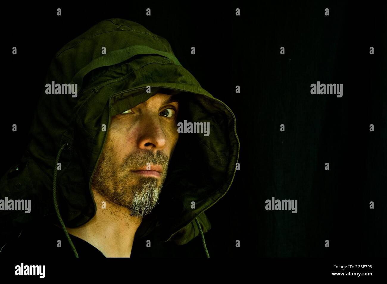 Man in the hood hi-res stock photography and images - Alamy