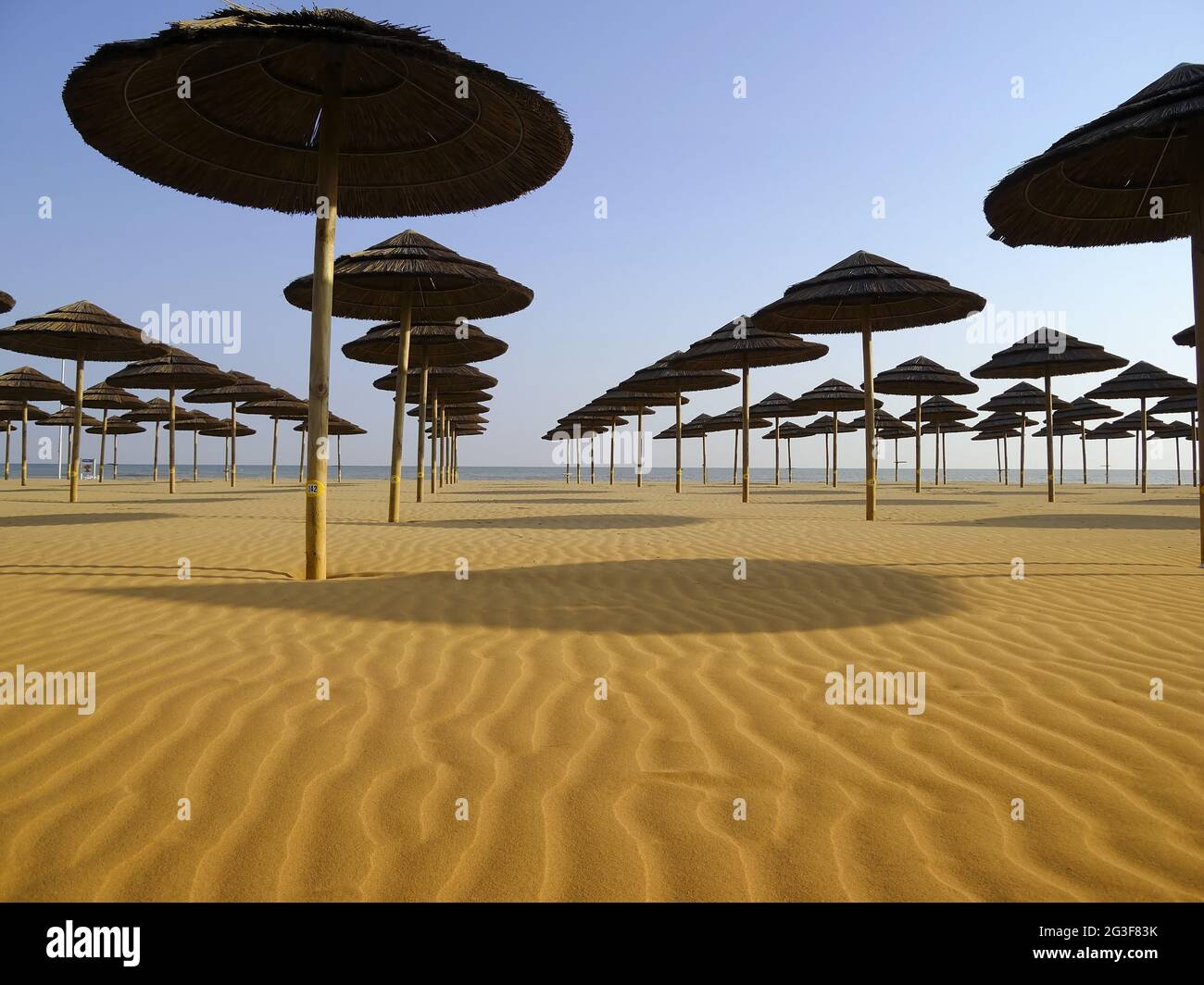 Straw umbrellas 10 Stock Photo - Alamy