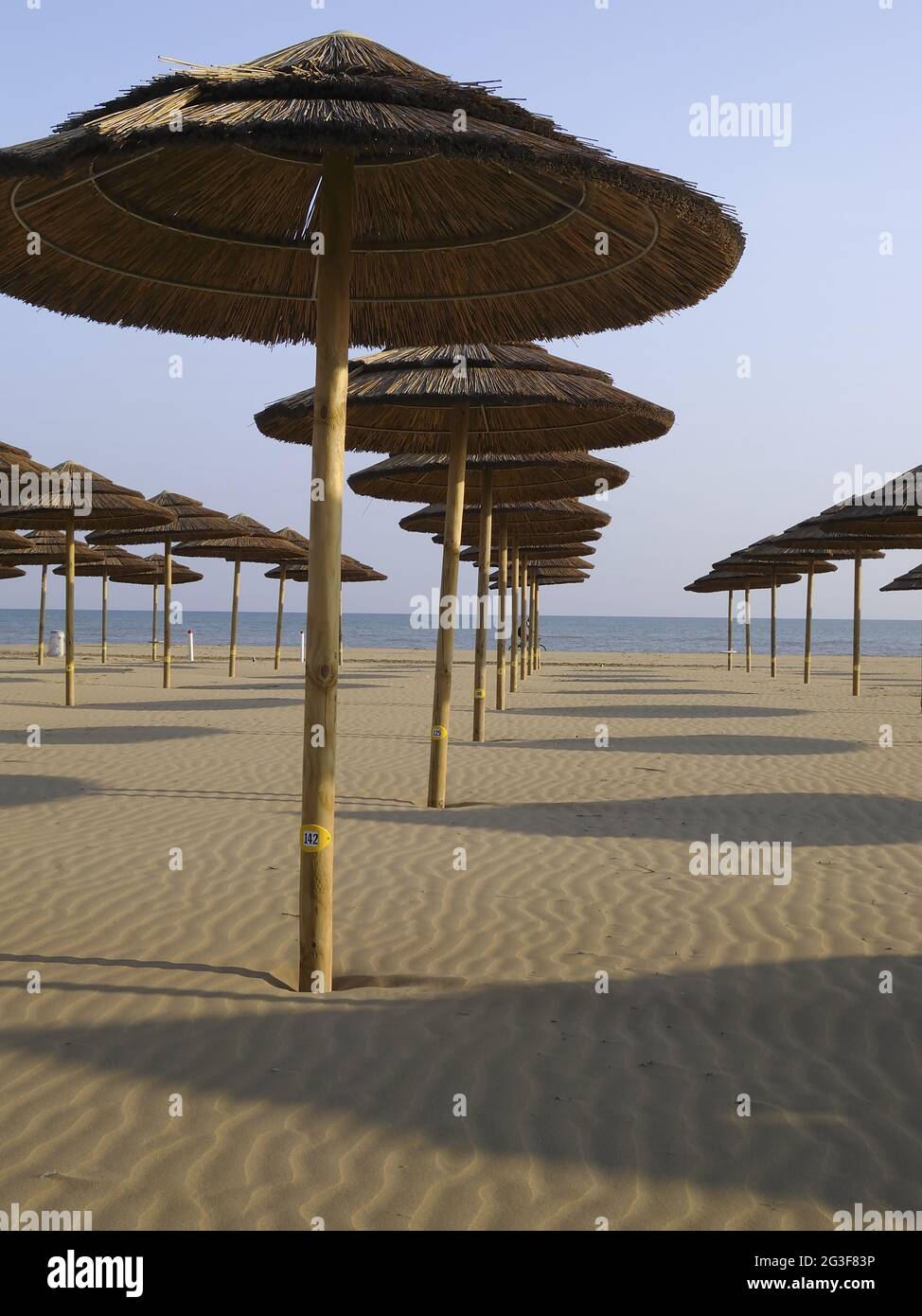 Straw umbrellas 06 Stock Photo - Alamy