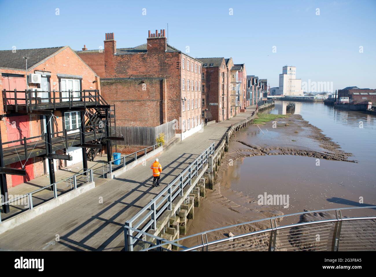 A man takes a walk along the now deserted and empty docks area of Hull ...