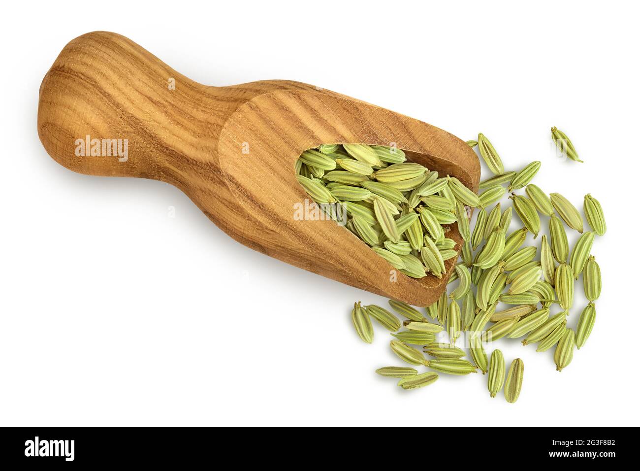 Dried fennel seeds in wooden scoop isolated on white background with ...