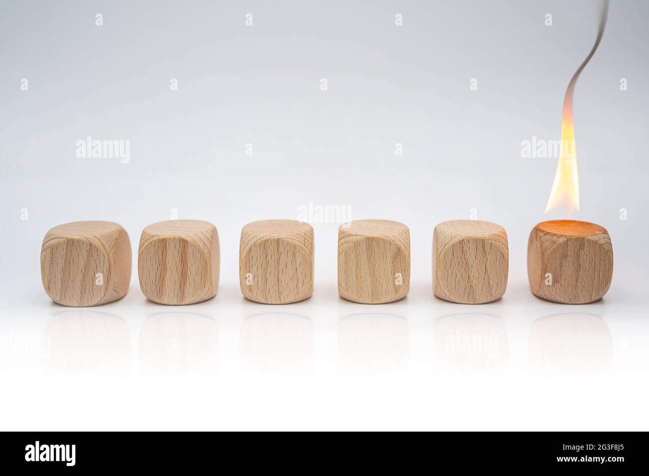 Six empty wooden cubes with space for individual adjustments with a ...