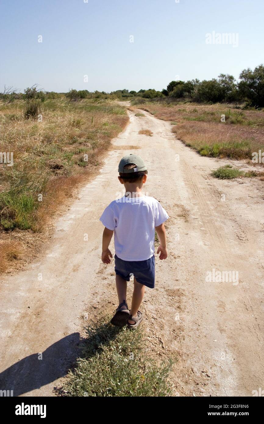 Child on the road Stock Photo - Alamy