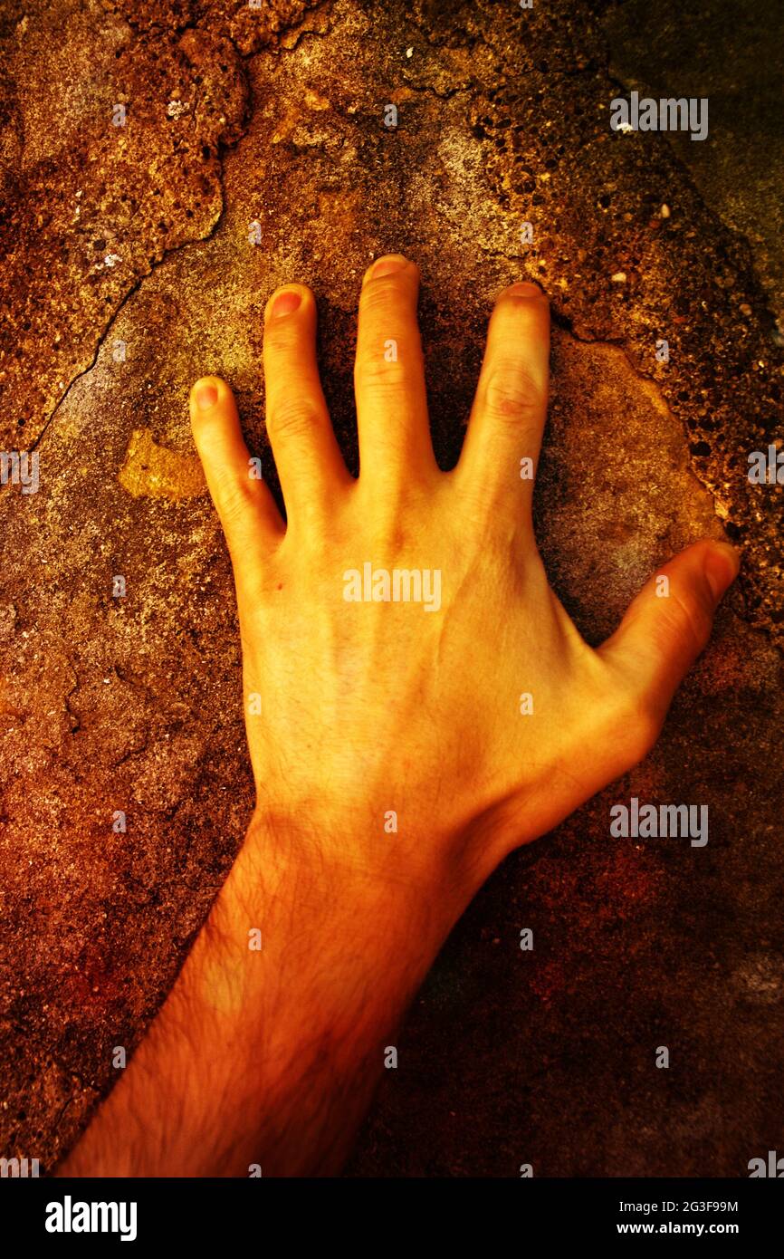 Hand on stone Stock Photo - Alamy