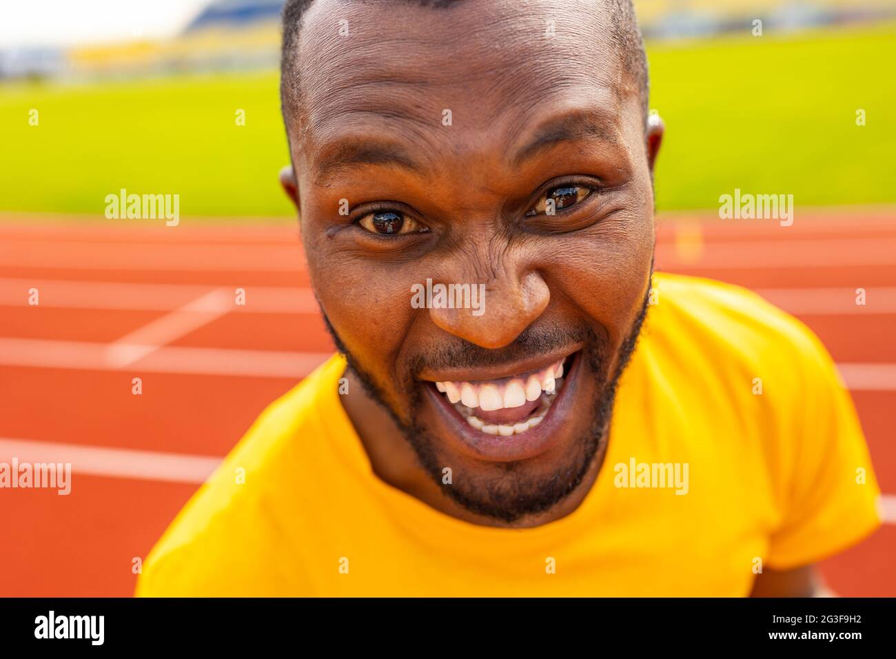 Close up of young fitness sporty african american black man in yellow ...