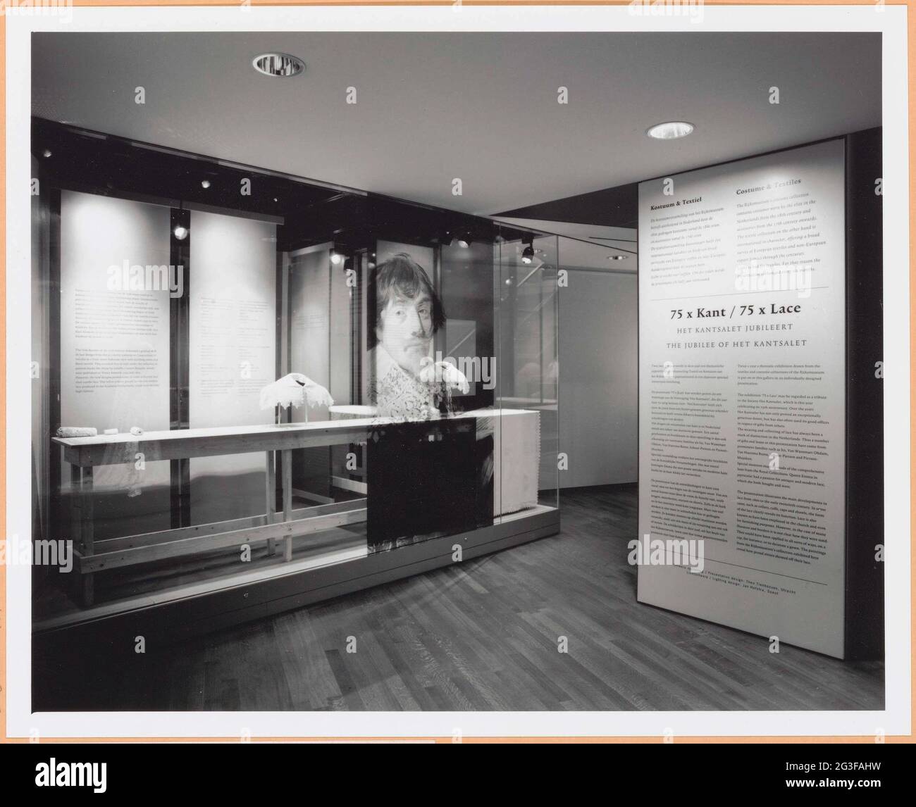 Showcase with lace objects and an information panel with the exhibition ...