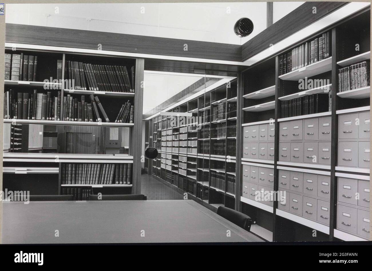 Spaces with cupboards and cards, separated by a glass door; Interior ...