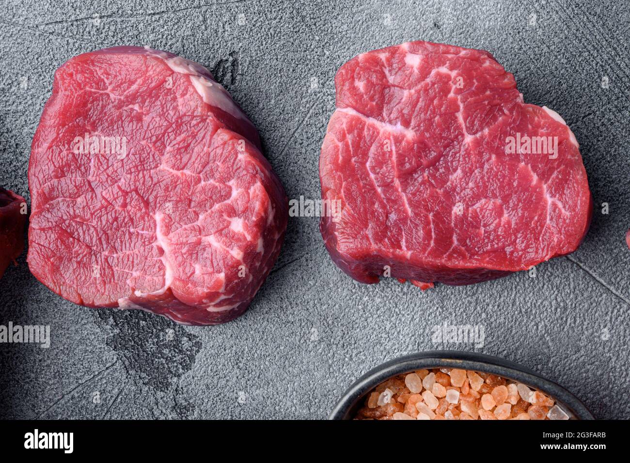 Prime Raw Fillet Mignon tenderloin steaks set, on gray stone background ...