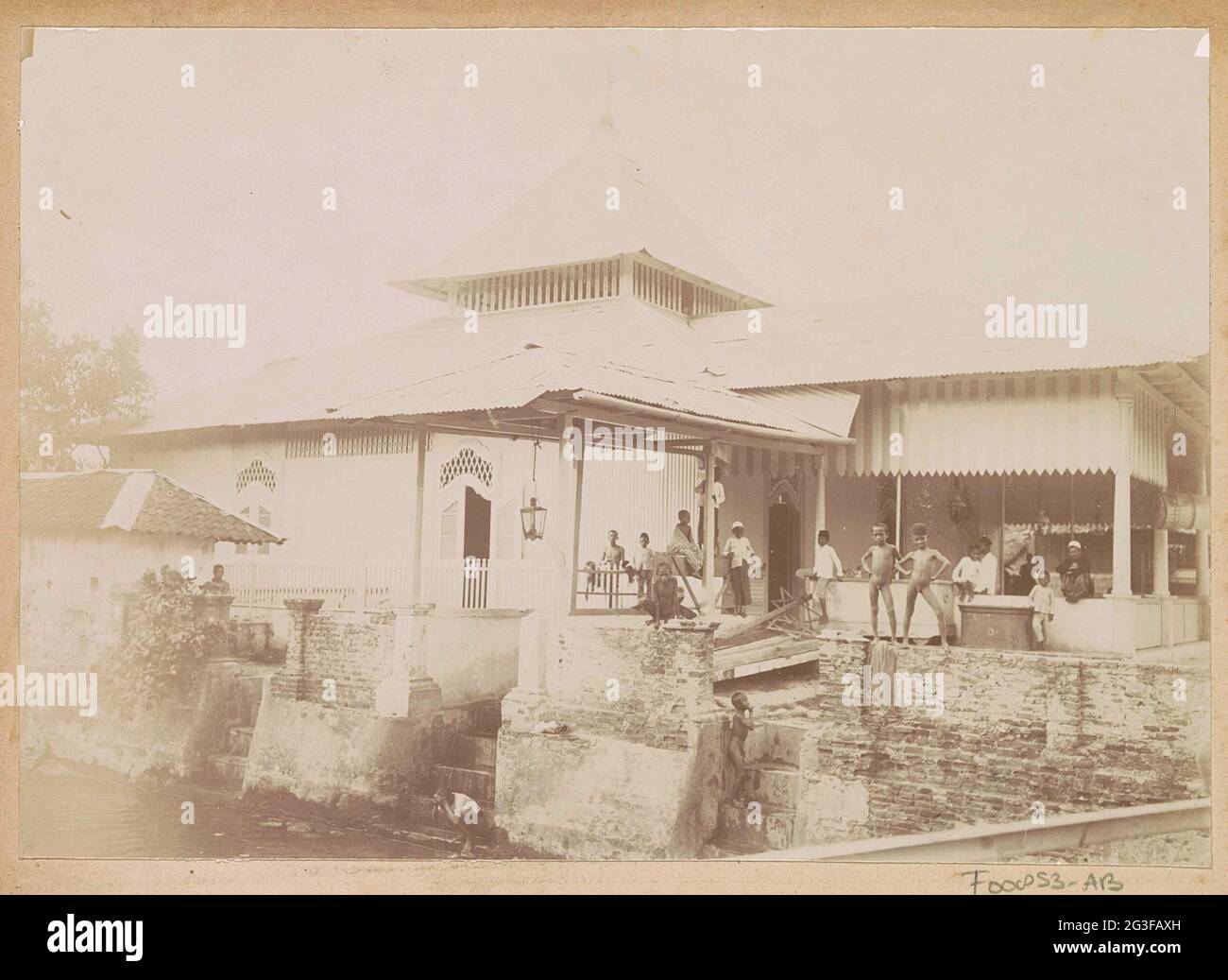 Swimming children and men at (possibly) a mosque on Ambon. Part of ...