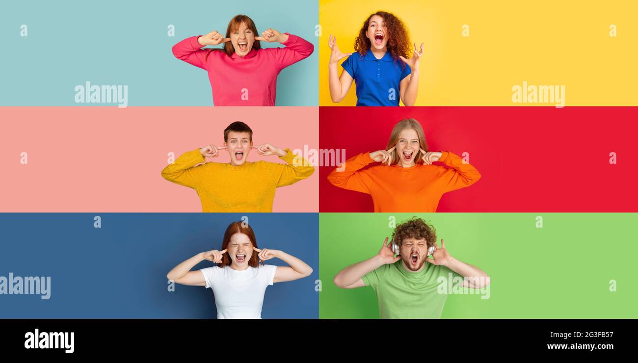 Screaming in headphones. Portrait of young people on light, blue ...