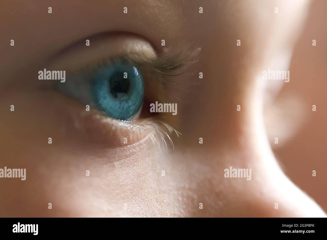 Yound child with blue eyes Stock Photo - Alamy