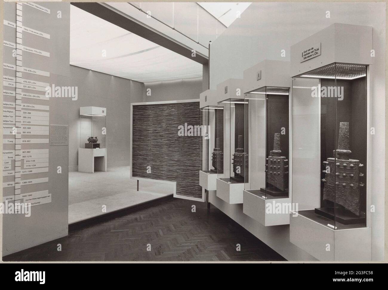 Room with links a time bar and on the right four bronze bells in ...