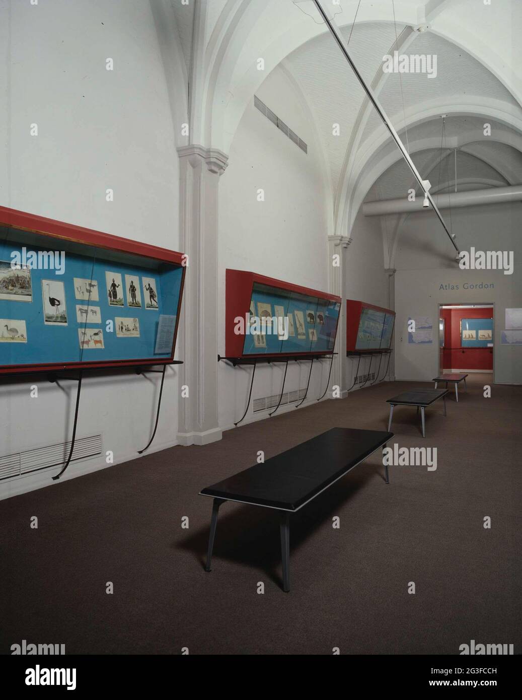 Room with prints and / or drawings in showcases and banks for visitors ...