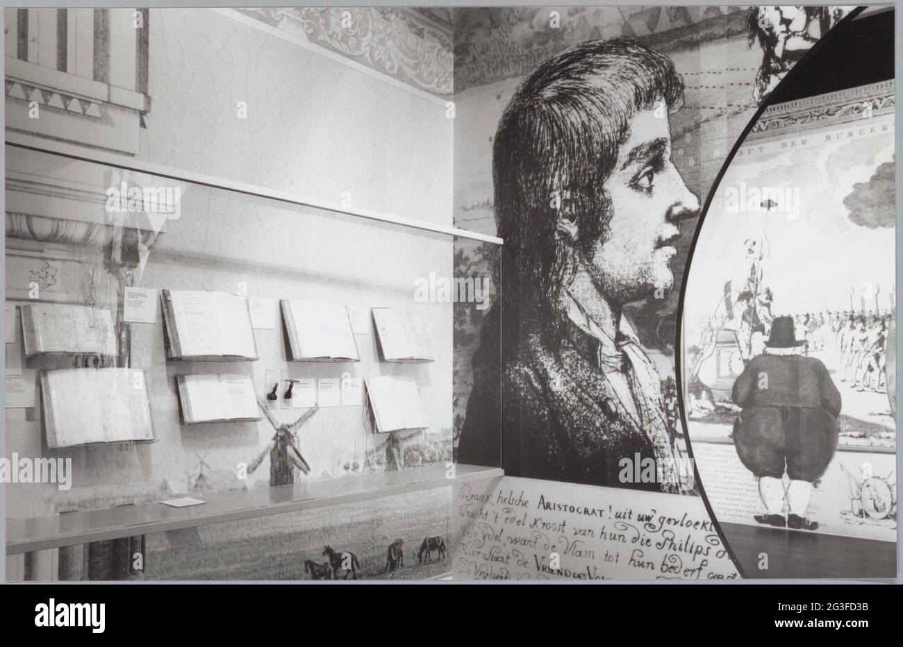 Wall vitrain with books in addition to bloated reproductions of ...