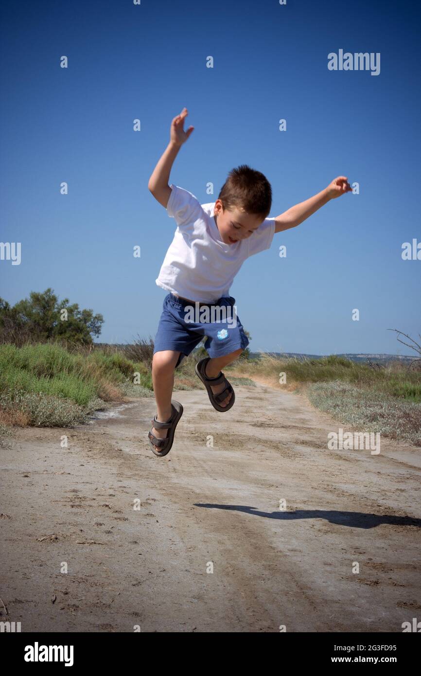 Happy jumping child Stock Photo - Alamy