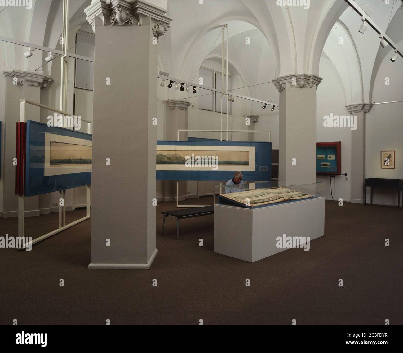 Room with visitor at two prints of panoramic landscapes; Exhibition ...