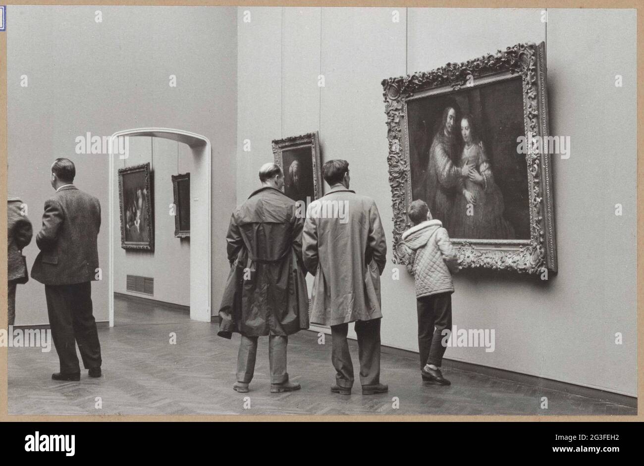 Room with visitors who view Paintings by Rembrandt. Right hangs 'the ...