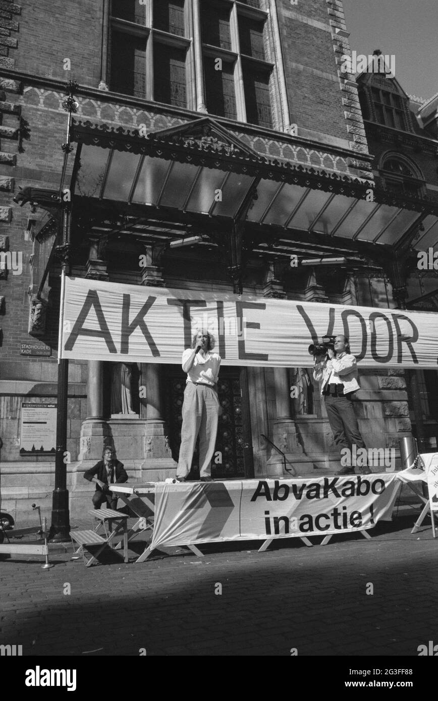 Two people stand on a table for a banner; Strike Stock Photo - Alamy