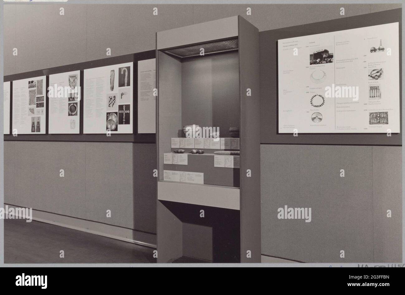 Room with various objects in a display case and information panels ...