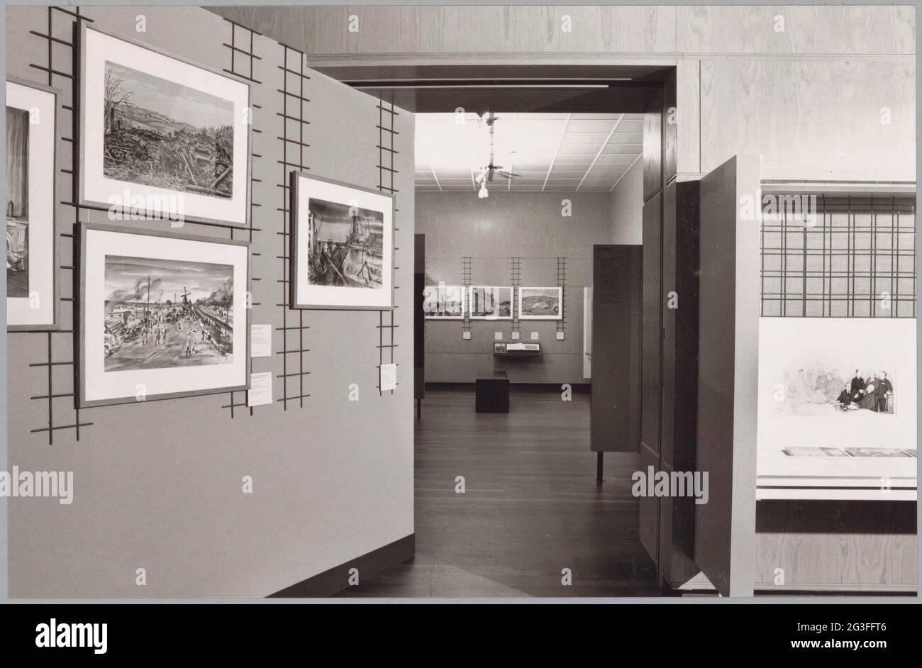 Room with drawings next to a view to another room; Exhibition war art ...