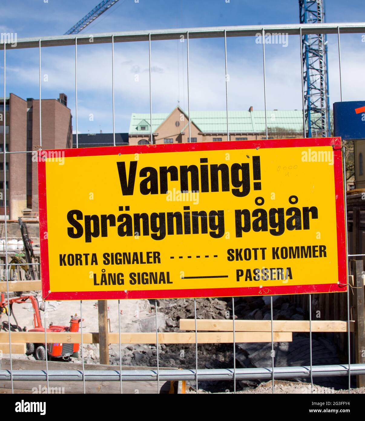 Sign warning of blasting work on a construction site Stock Photo - Alamy