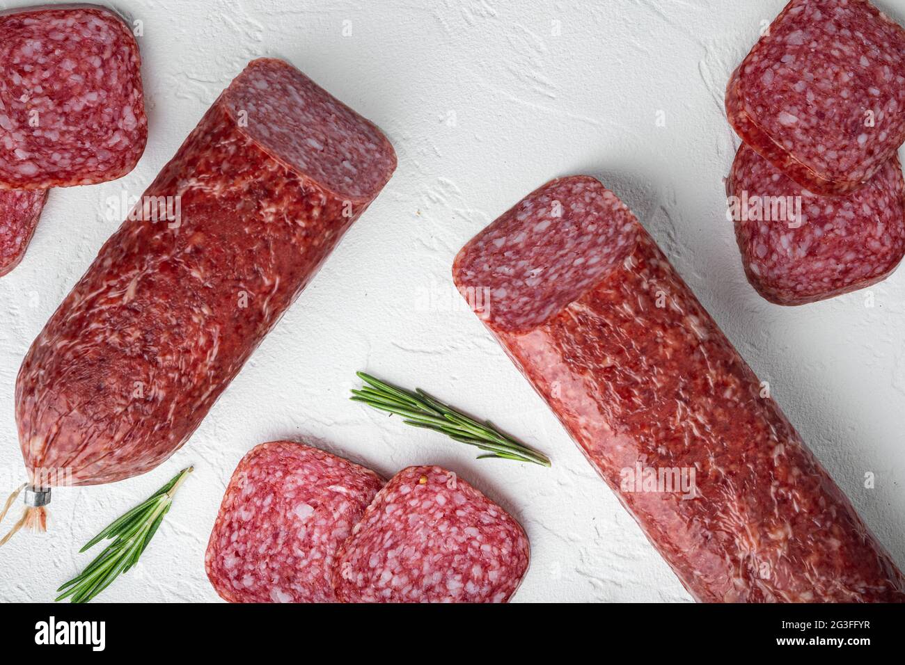 Sliced salami set, on white stone table background Stock Photo - Alamy