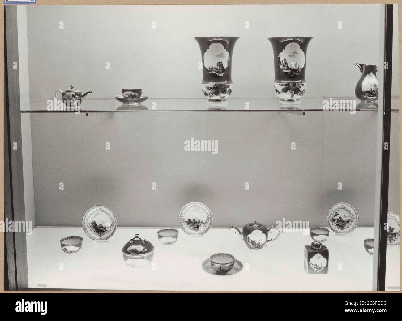 Showcase with objects of ceramics, including vases of Meissen porcelain ...