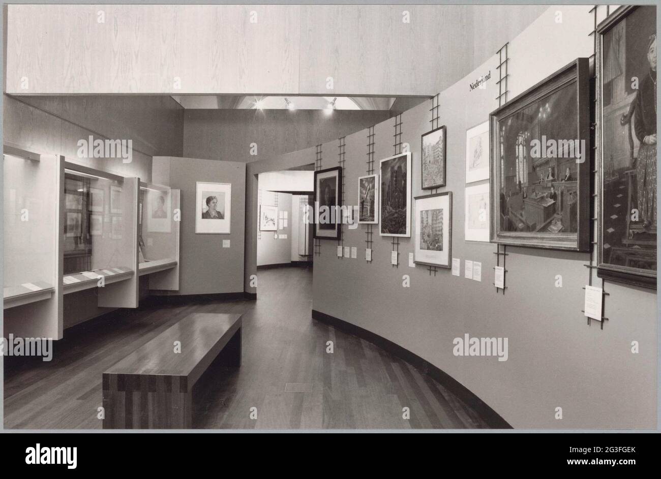 Room with paintings and drawings, left wall vitate and a passage ...