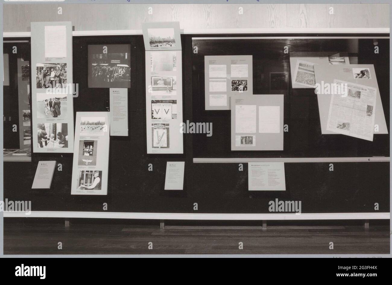 Showcase with photos, documents and newspaper articles; Exhibition in ...