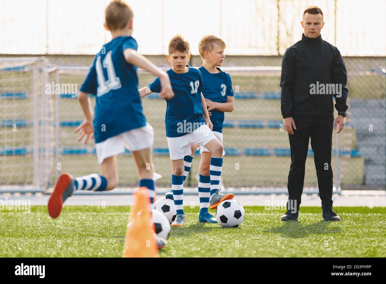 Coaching Kids Soccer. Young Man as Soccer Coach Trainer on Football ...