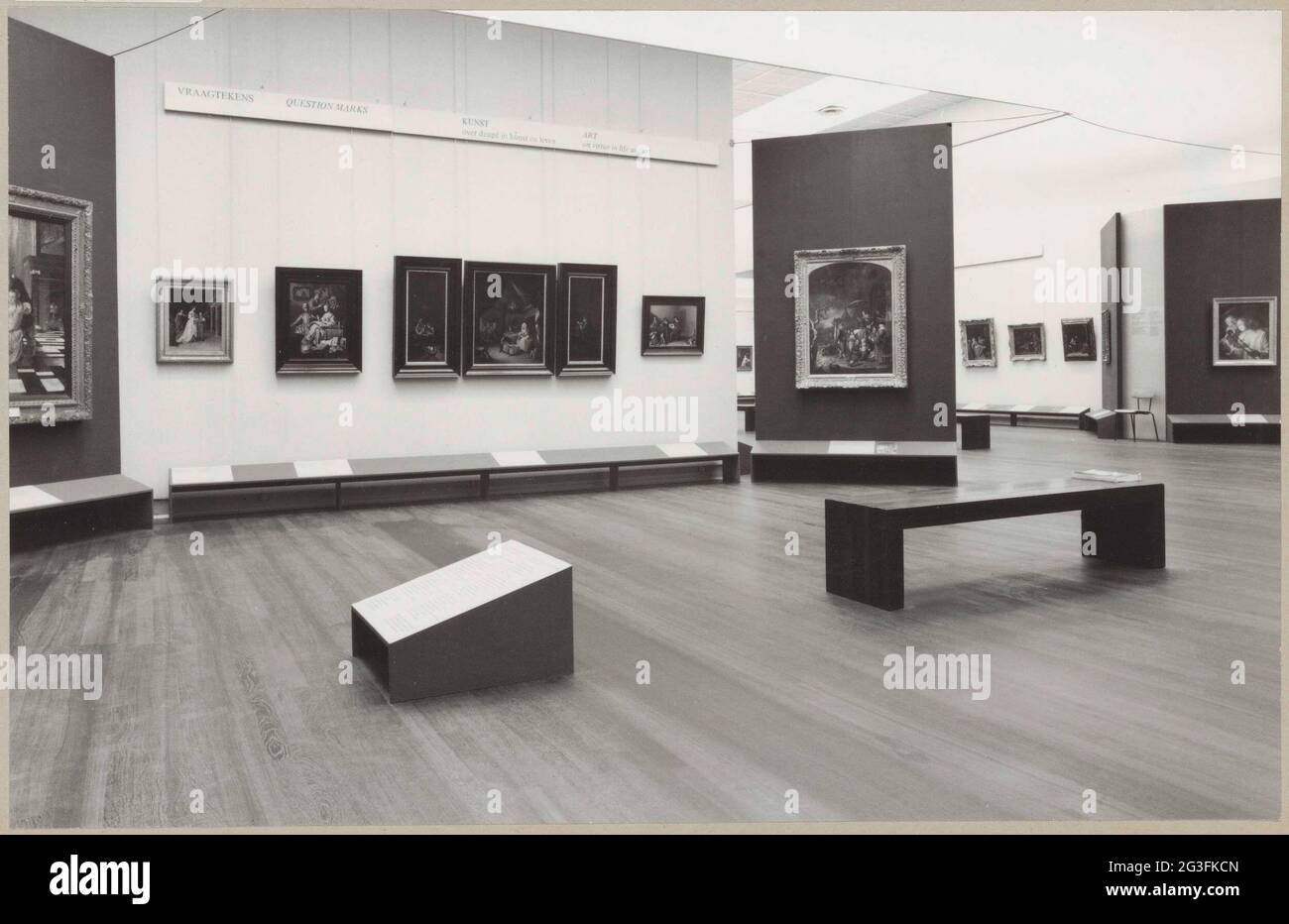 Room with paintings on the wall and on four sloping panels; Exhibition to learning and ...