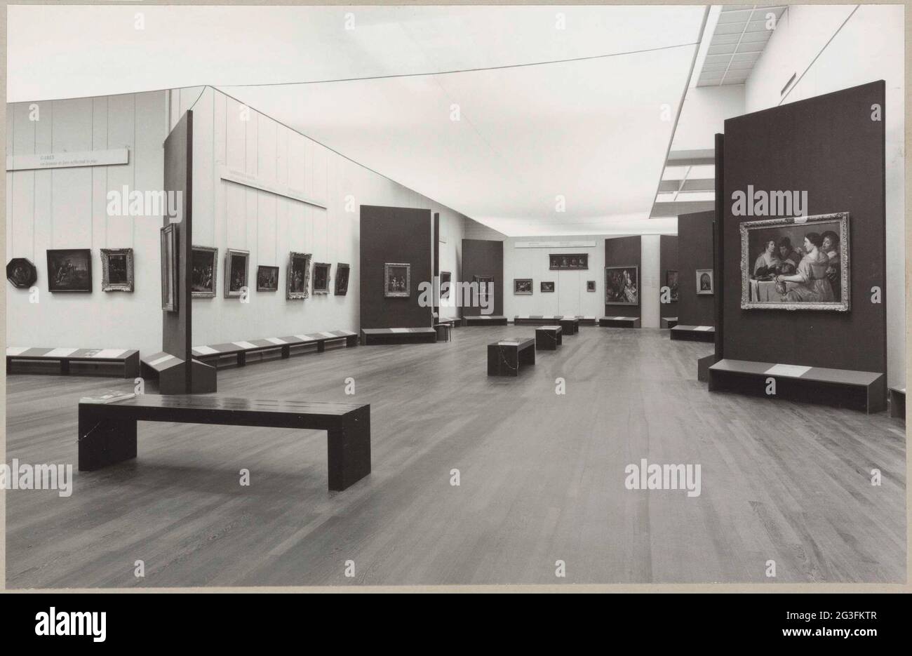 Room with paintings on the wall and on sloping panels; Exhibition to learning and entertainment ...