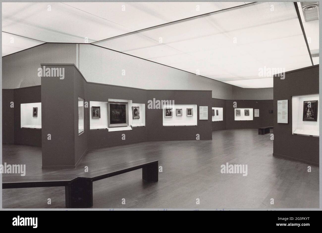 Room with paintings in showcases, information panels and banks for ...