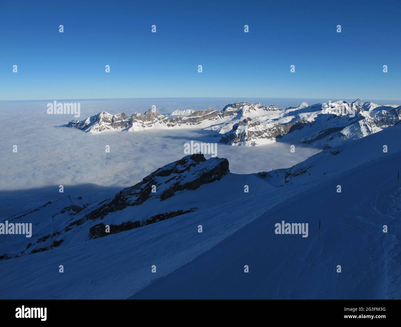 Morning on the Titlis. Mountains and sea of fog Stock Photo - Alamy