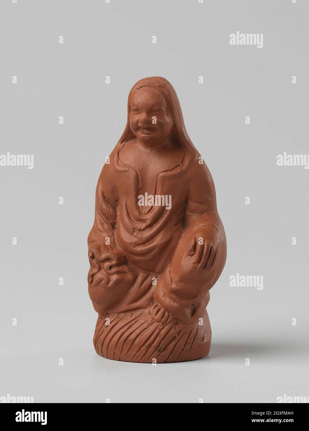 Human figure of redbaging pottery. Human figure of red-baked pottery ...