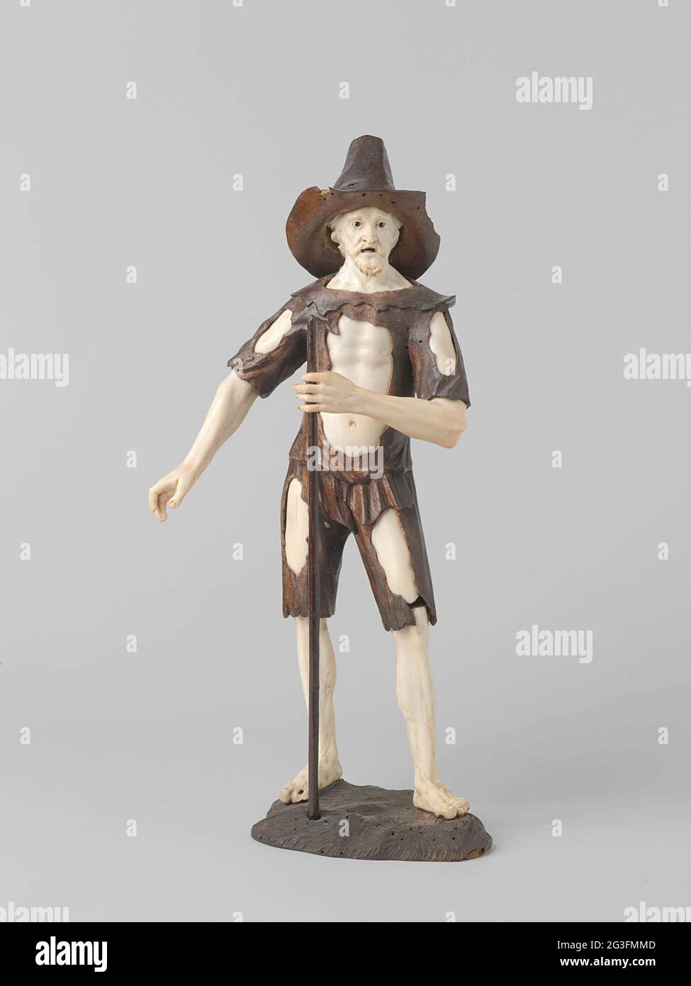Begging figure with staff. Beggar with staff Stock Photo - Alamy