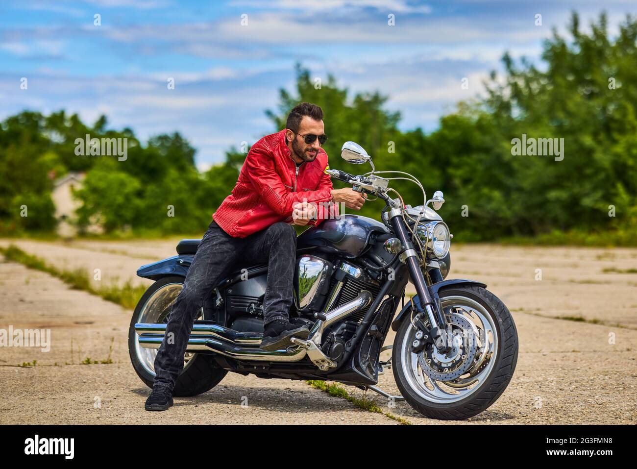 Man standing pose with cycle hi-res stock photography and images - Alamy