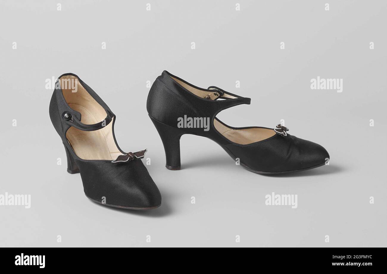 Ladies shoe made of black satin with ankle strap and black clamping ...