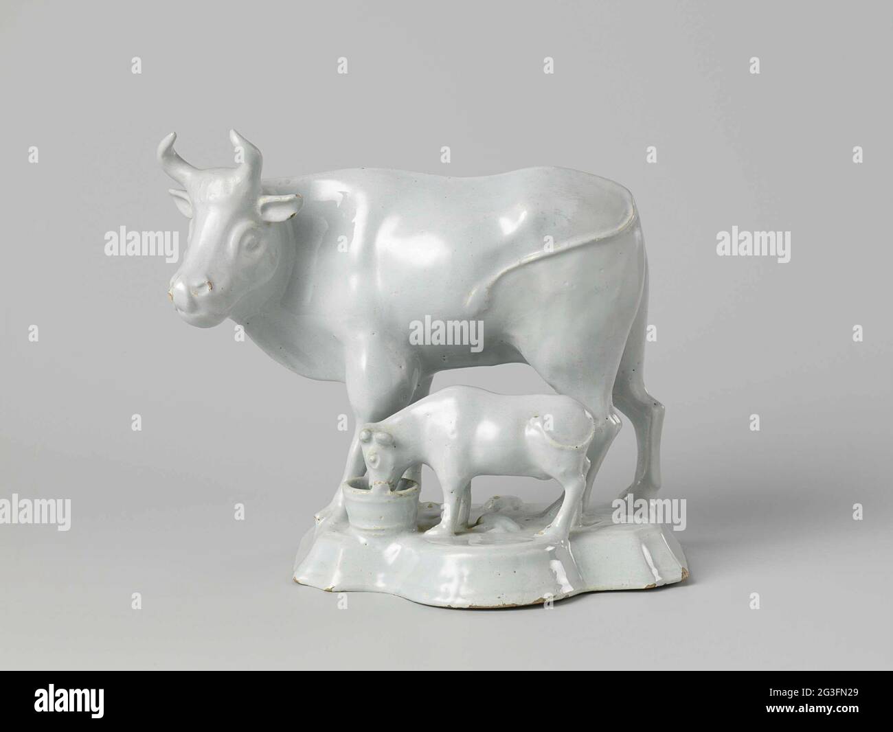 Cow and calf with Tobbe and pedestal with leafwork and frogs in relief ...