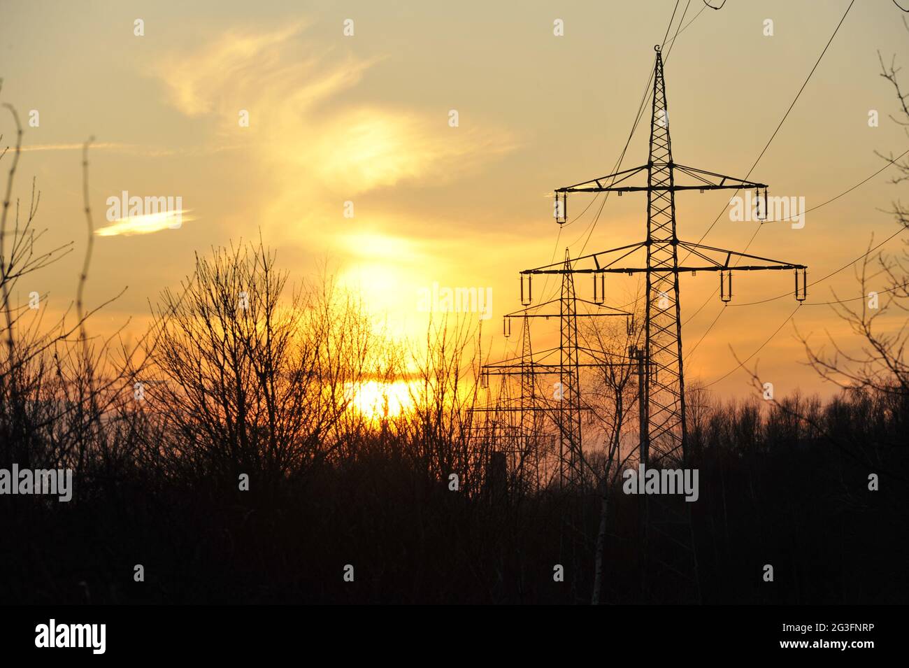 Electricity pylons at sunset hi-res stock photography and images - Alamy