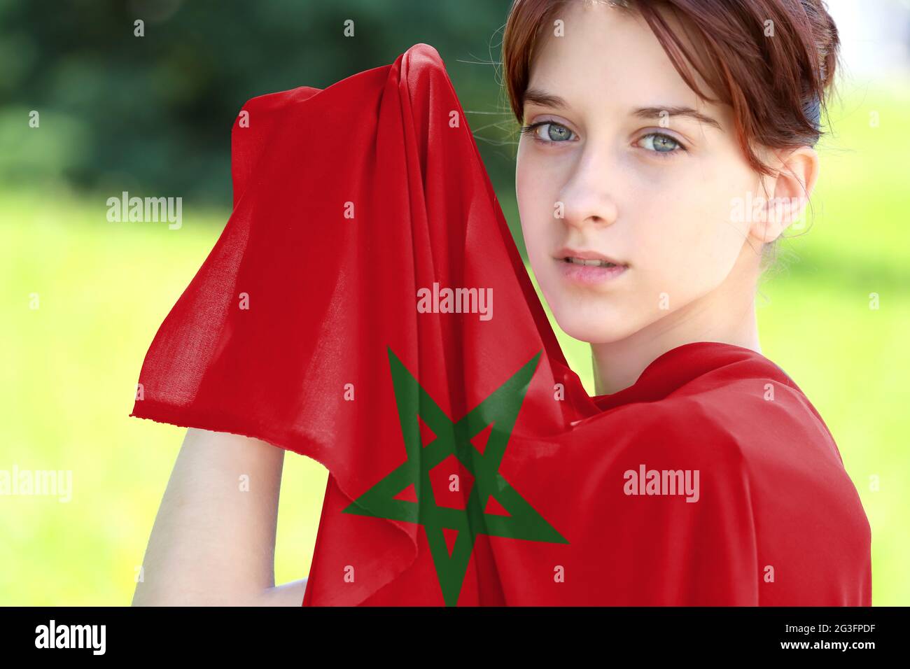 Young girl holding the flag of Morocco close up Stock Photo - Alamy